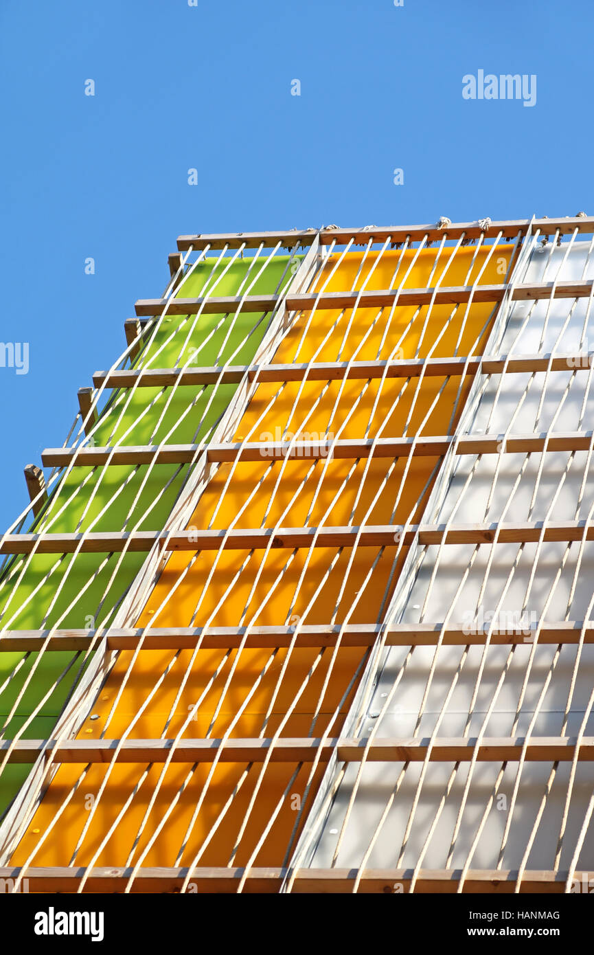 Modern multi colored glass building. Exterior of the local commercial ...