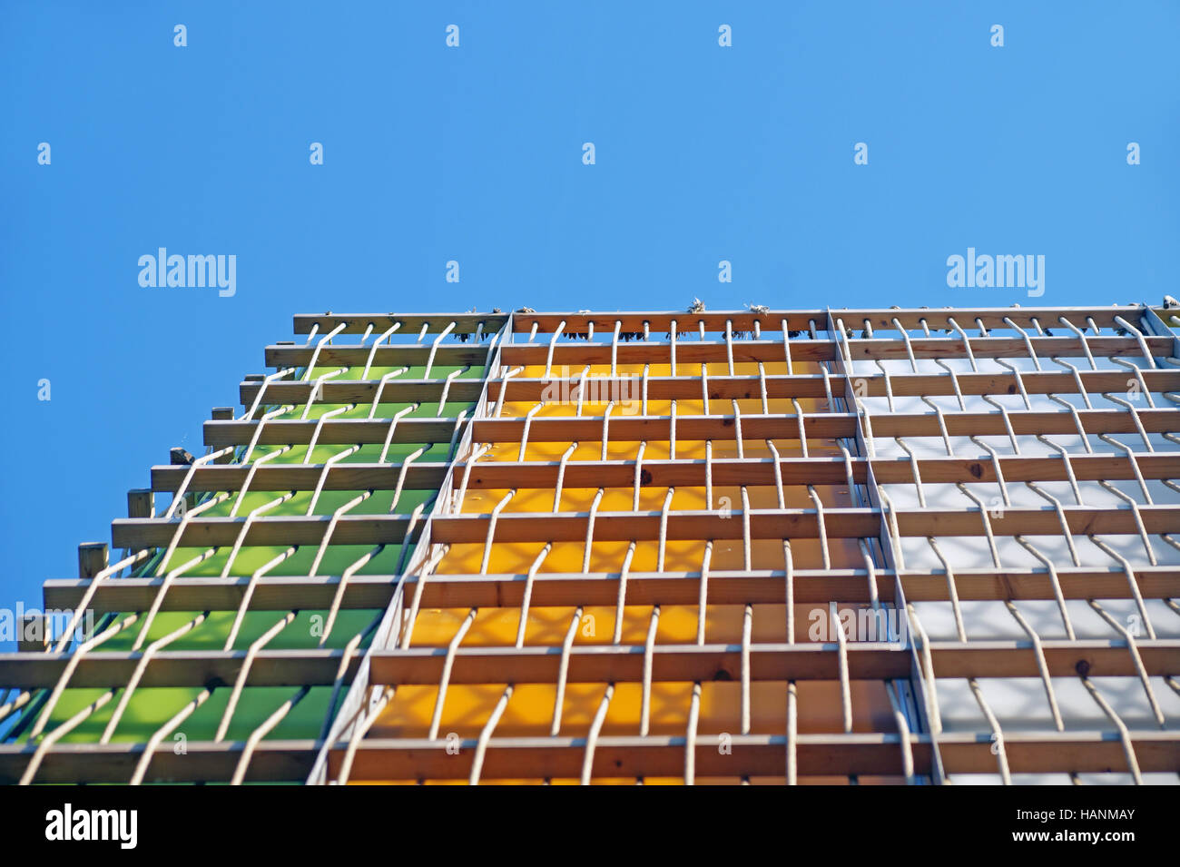 Modern multi colored glass building. Exterior of the local commercial ...