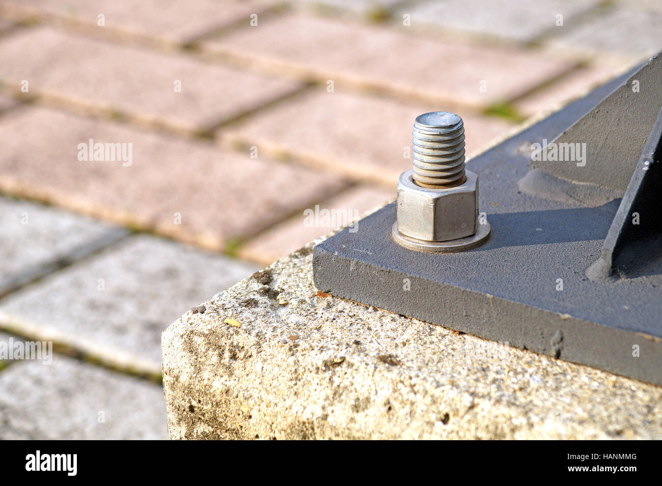 Nuts bolts pole of a lighting post base Stock Photo - Alamy