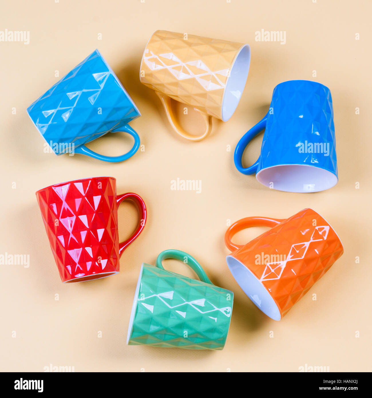 Set of six colored cups for coffee on a yellow background Stock Photo ...