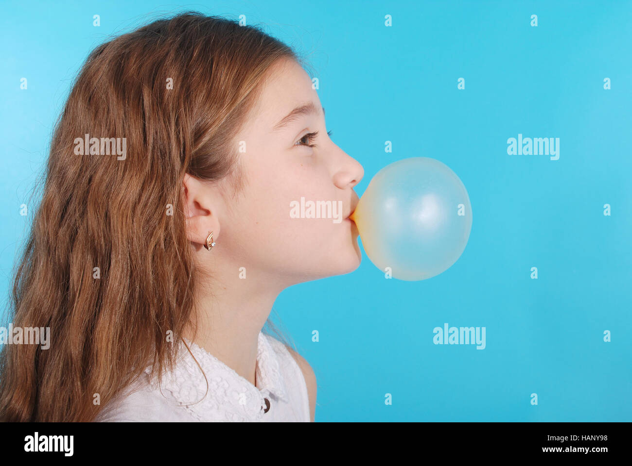 Girl blowing chewing gum bubble hi-res stock photography and images - Alamy