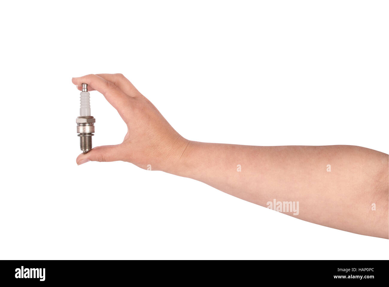 New sparking plug in a hand on a isolated white background. Photo with ...