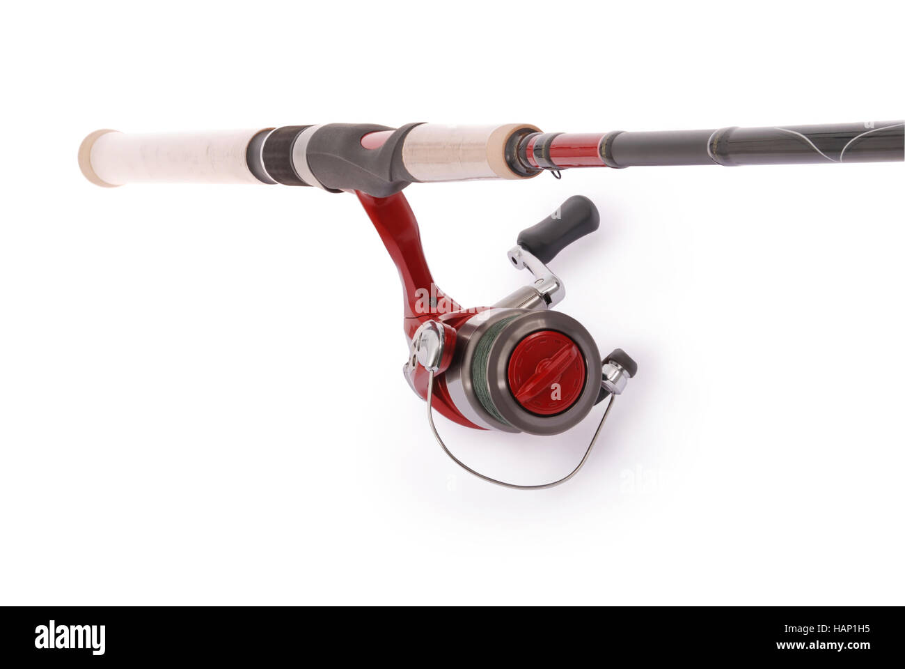 Fishing rod with a reel isolated on white background with soft shadow ...