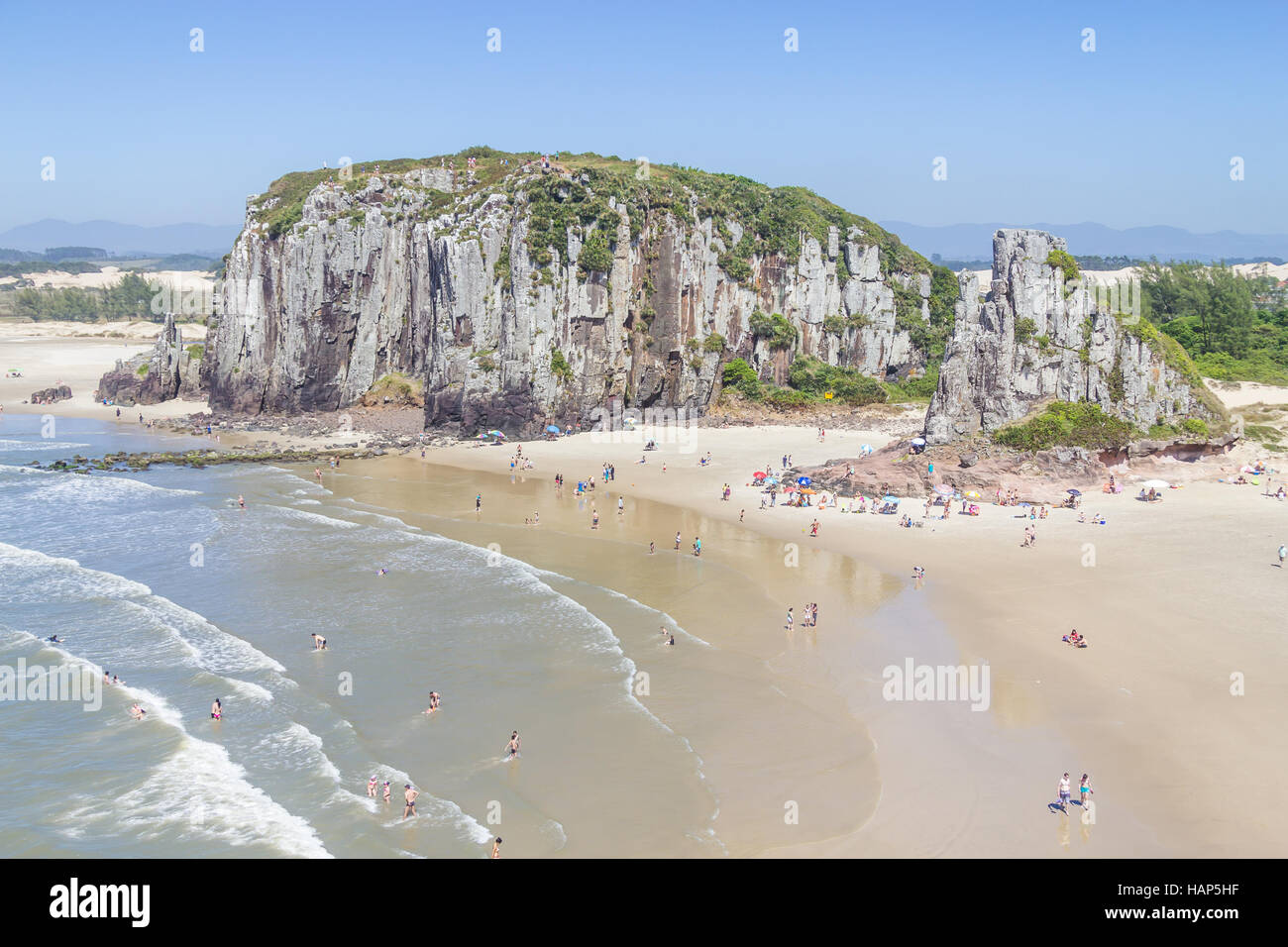 Beach, waves, sand and cliffs at Torres beach Stock Photo - Alamy