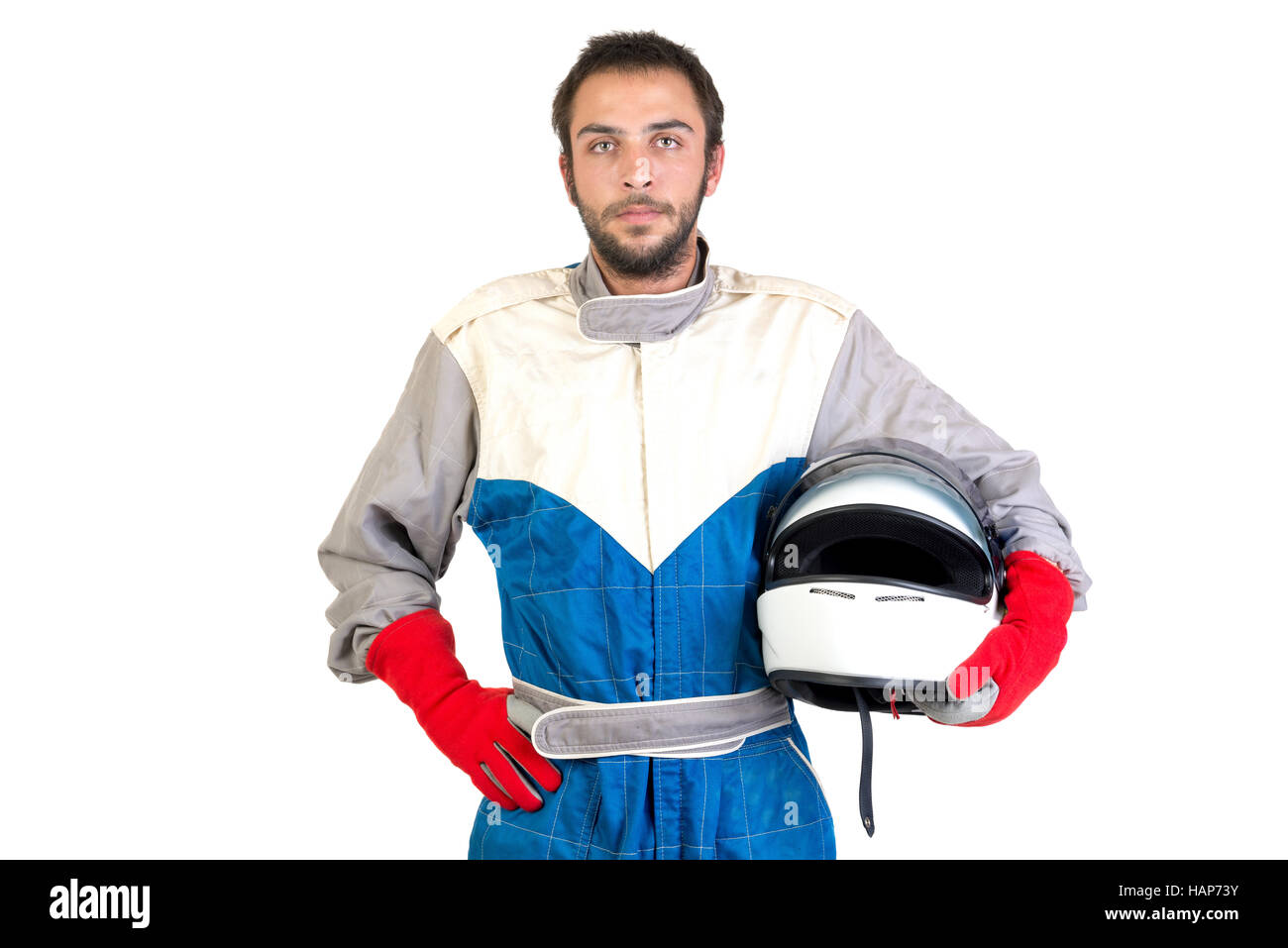 Racing driver posing with helmet isolated in white Stock Photo - Alamy