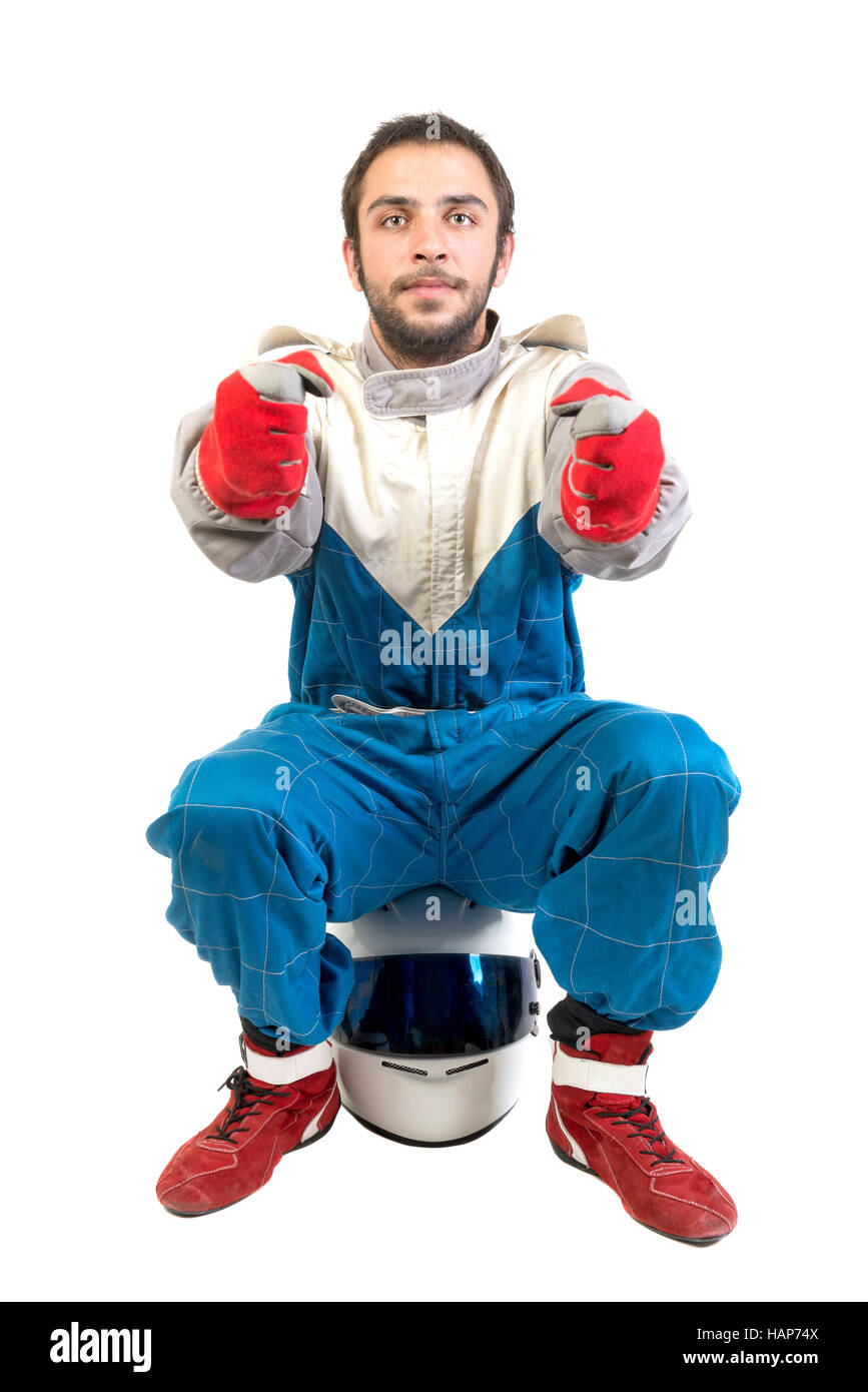 Racing driver posing with helmet isolated in white Stock Photo - Alamy
