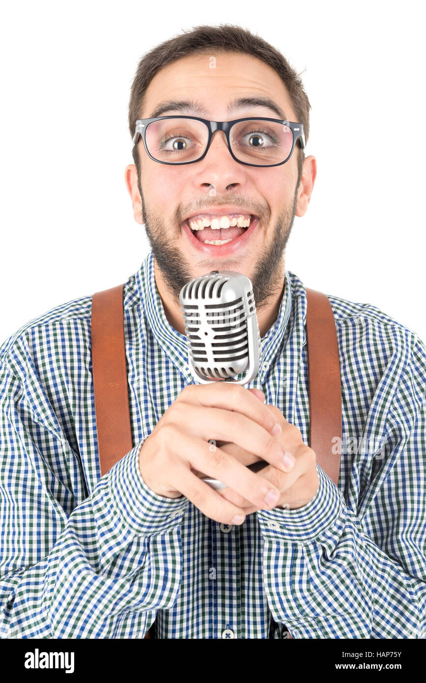 Young nerd posing with microphone isolated in a white background Stock ...