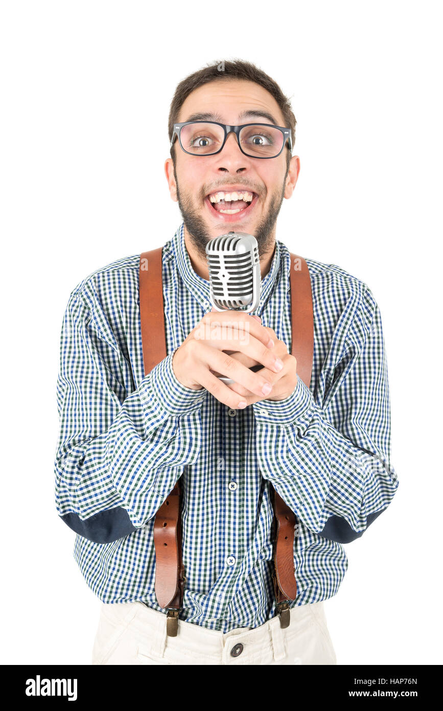 Young nerd posing with microphone isolated in a white background Stock ...