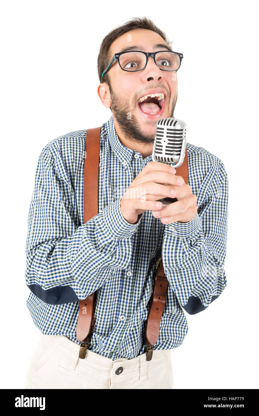 Young nerd posing with microphone isolated in a white background Stock ...