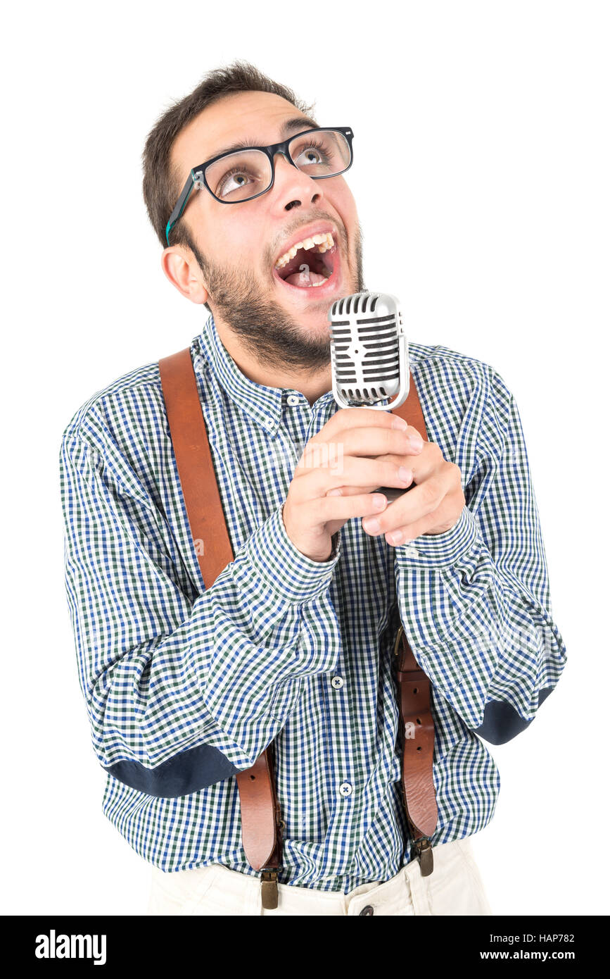 Young nerd posing with microphone isolated in a white background Stock ...
