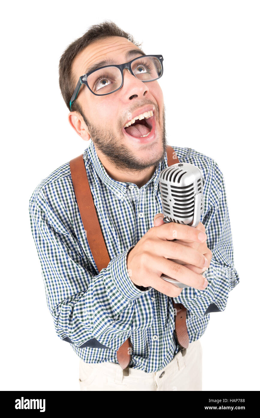 Young nerd posing with microphone isolated in a white background Stock ...