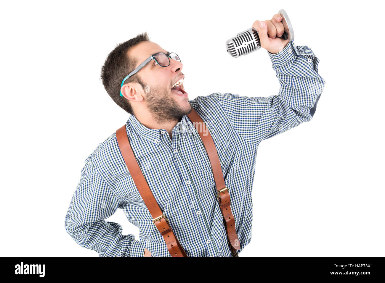 Young nerd posing with microphone isolated in a white background Stock ...