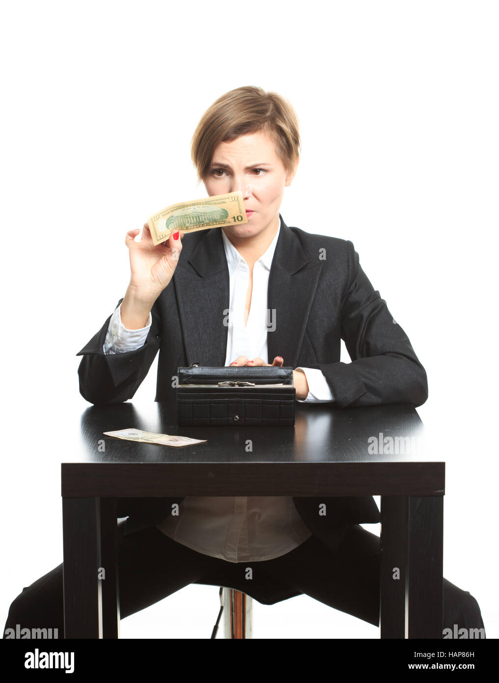 Woman taking money from purse Stock Photo - Alamy