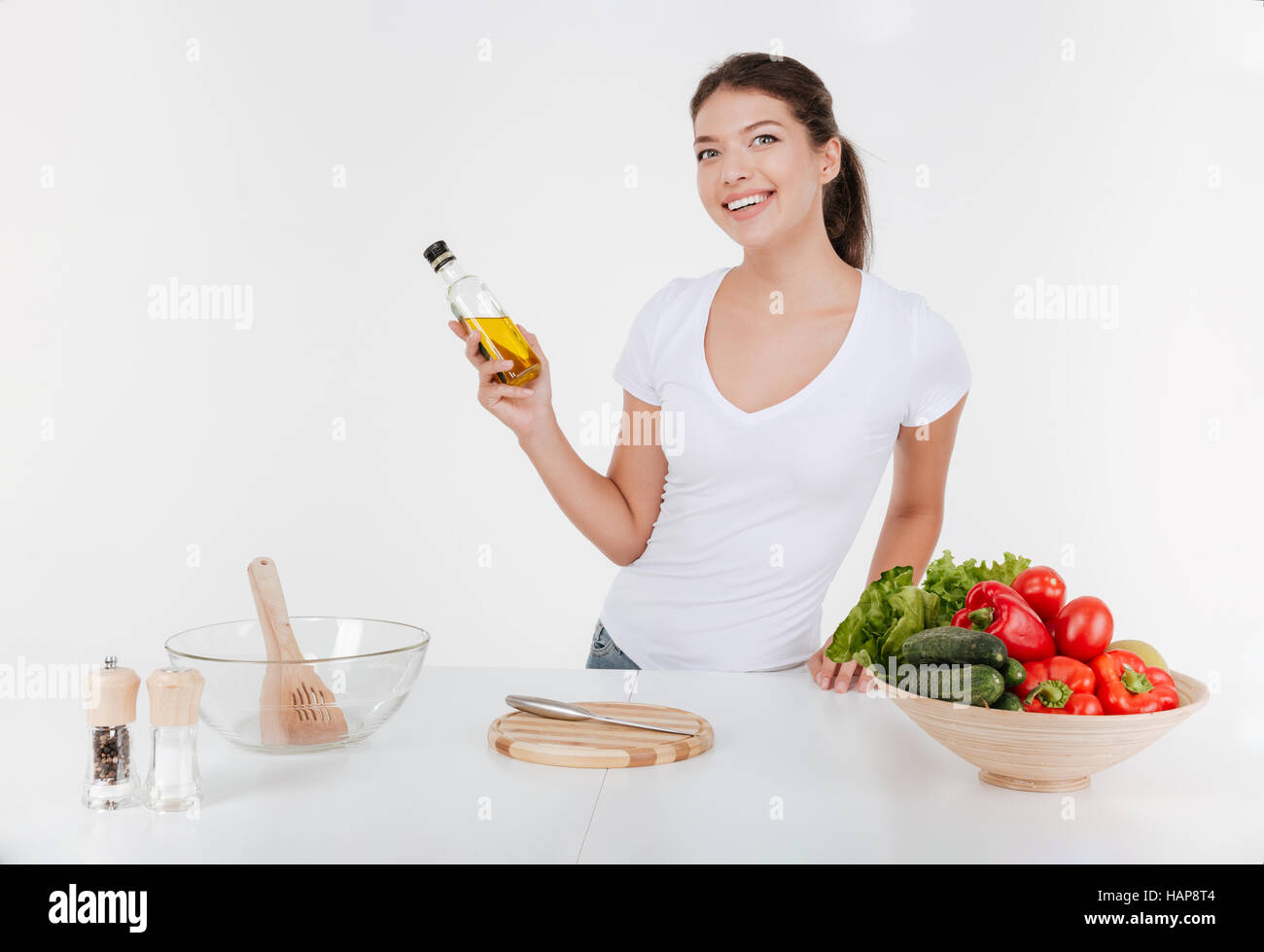 Smiling model by the table with food. Girl looking at camera Stock ...