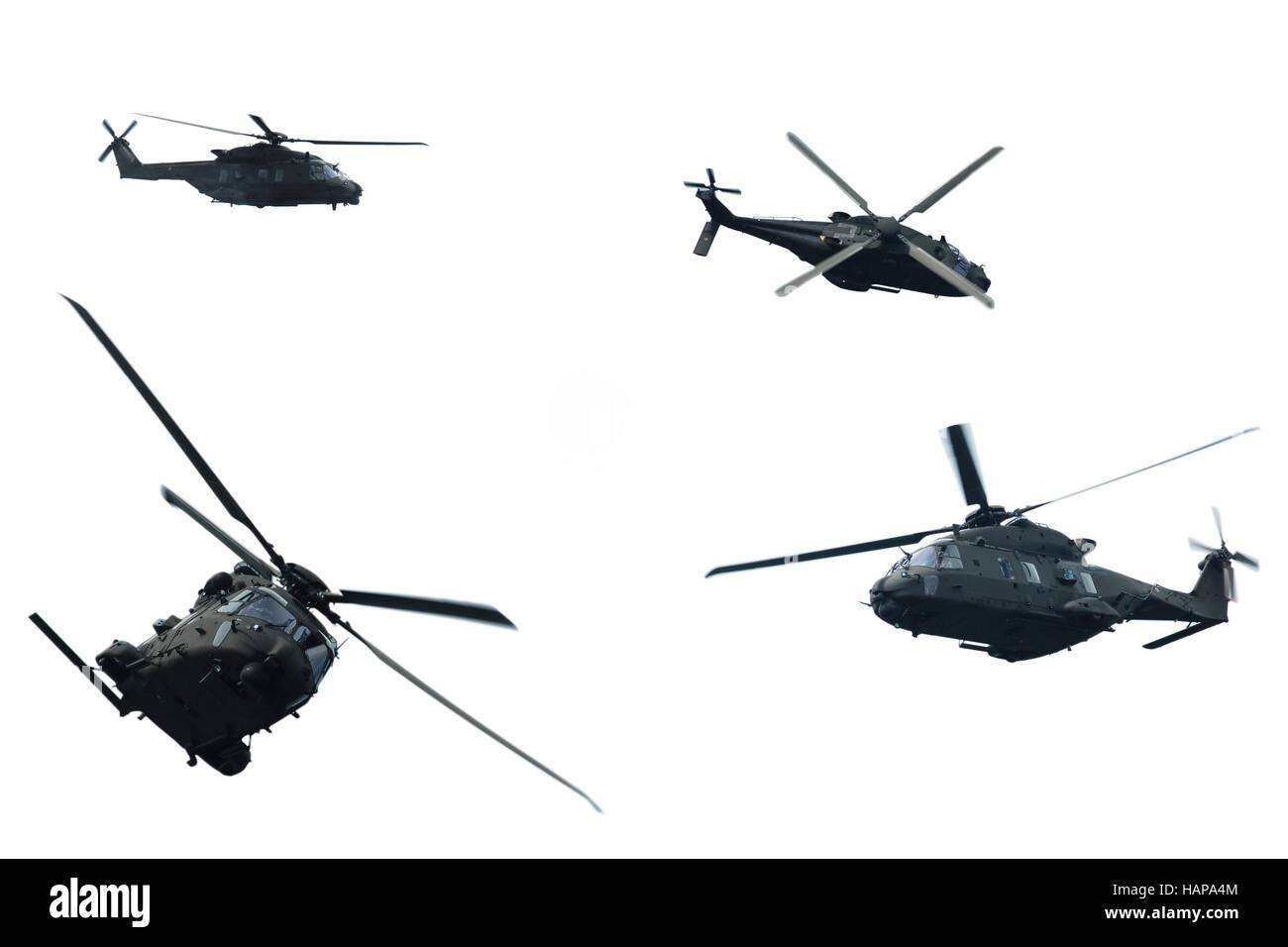 Four helicopters in flight during a military demonstration in front of ...