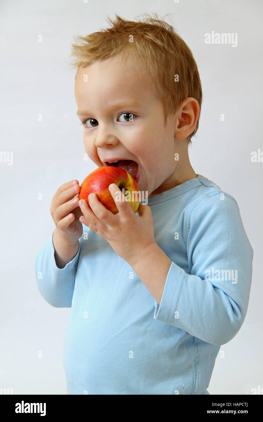 Child with apple Stock Photo - Alamy