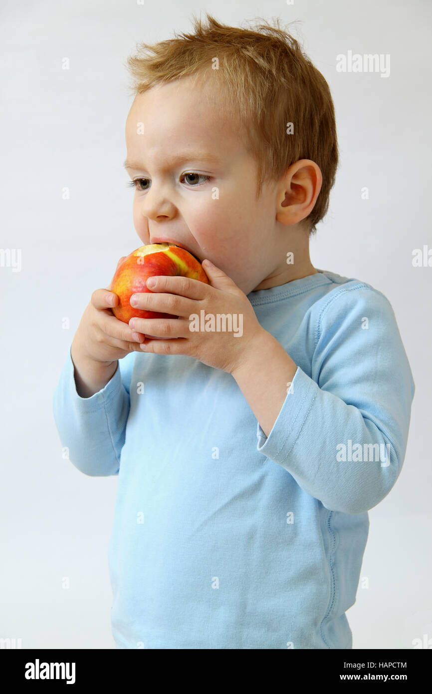 Child with apple Stock Photo - Alamy