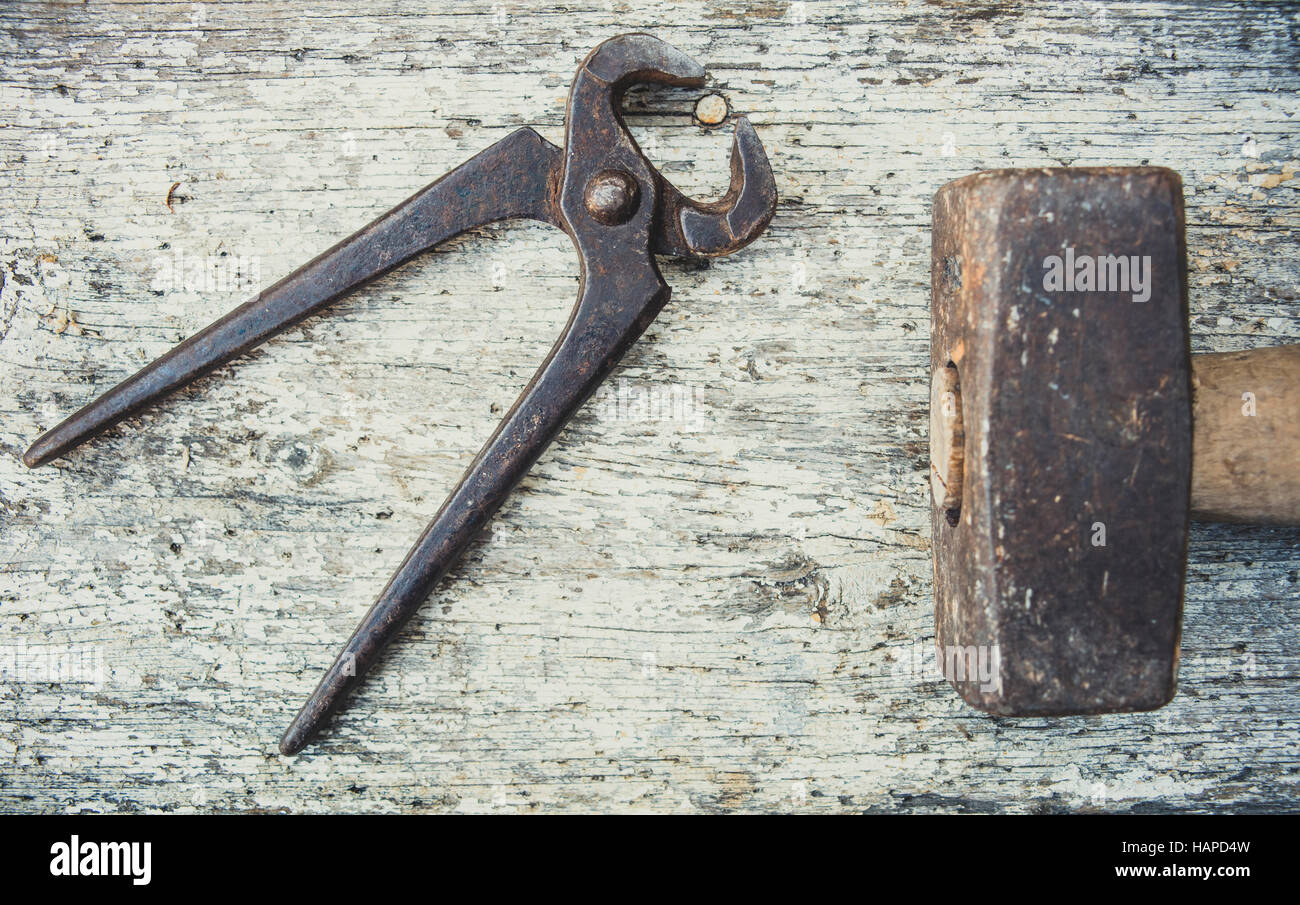 Pliers and hammer Stock Photo - Alamy