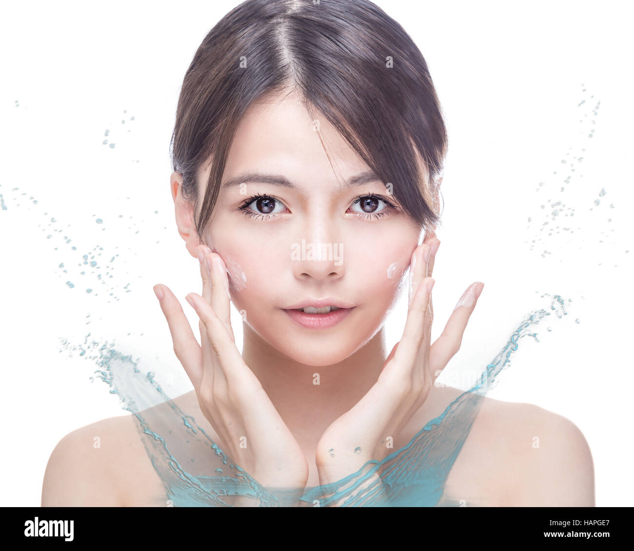 Chinese woman applying cream to face with water splash. skincare ...