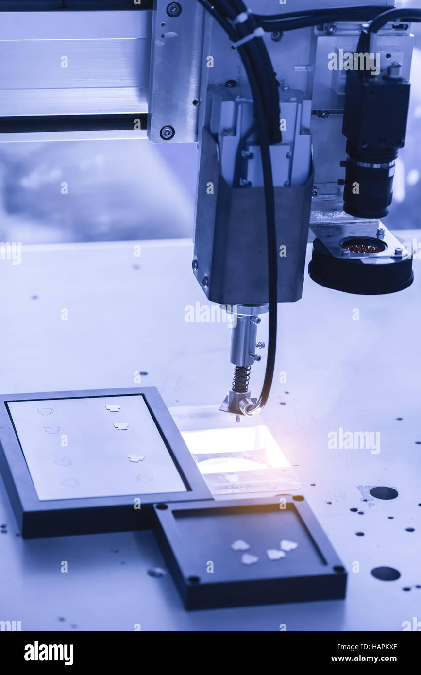 Industrial robot working in phone factory Stock Photo - Alamy