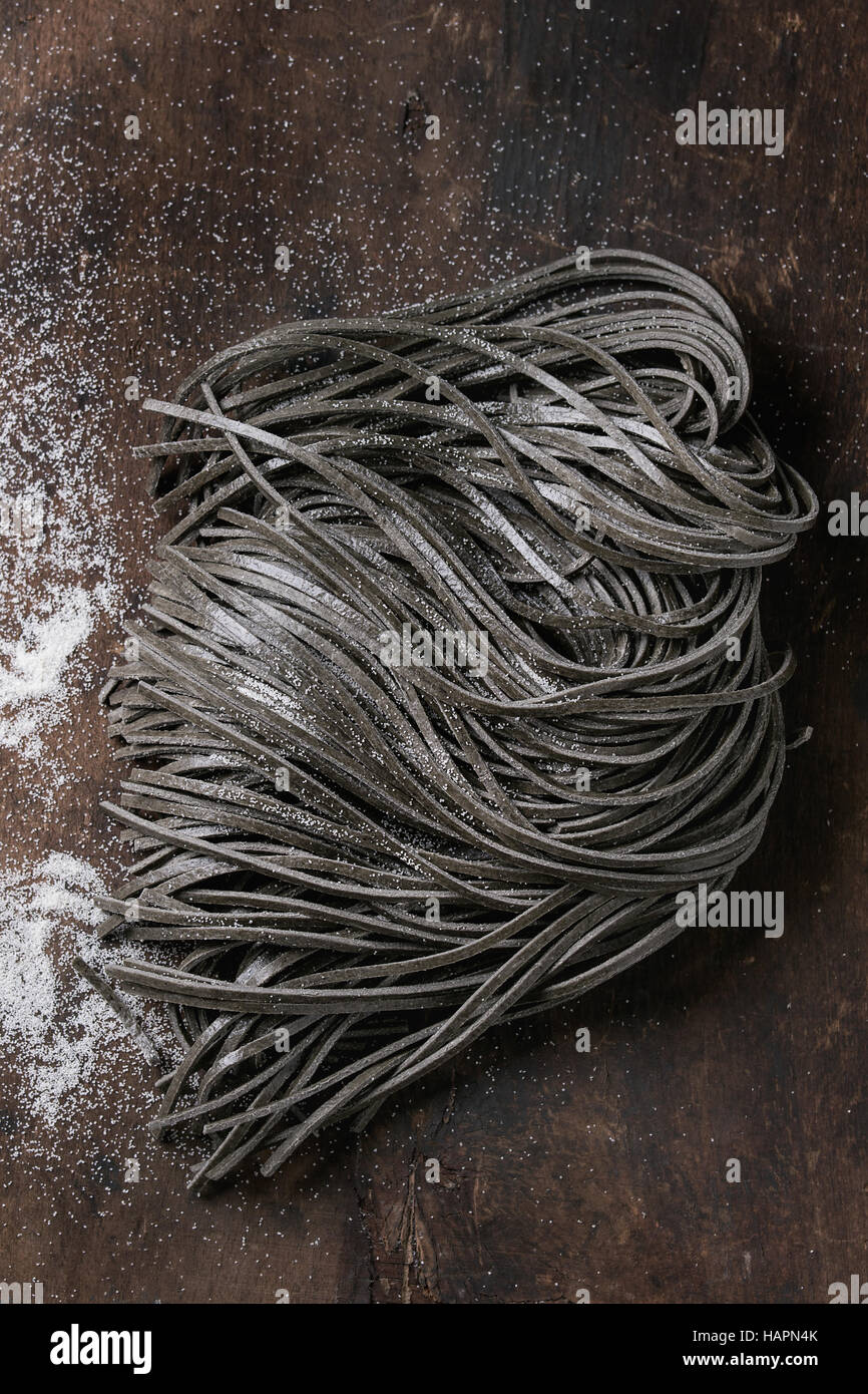 Raw black spaghetti pasta Stock Photo - Alamy