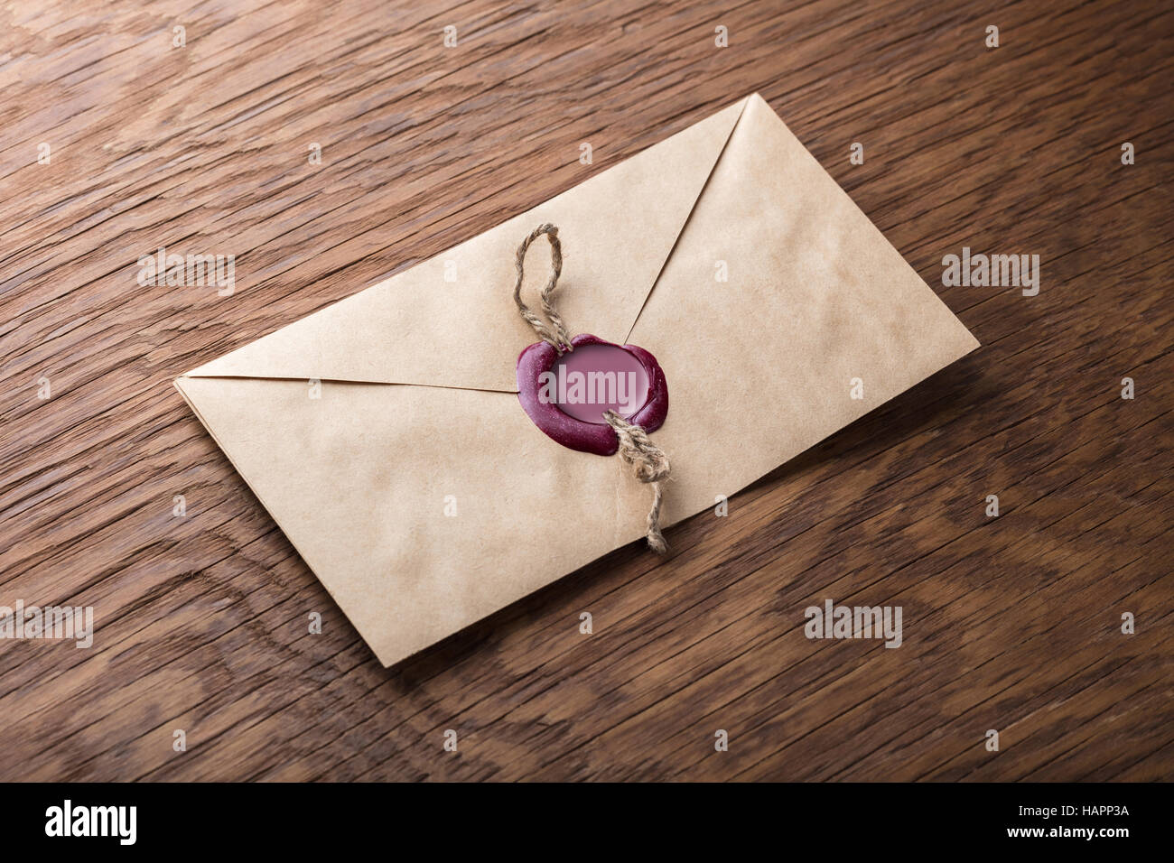envelope with a stamp on the wooden background Stock Photo - Alamy