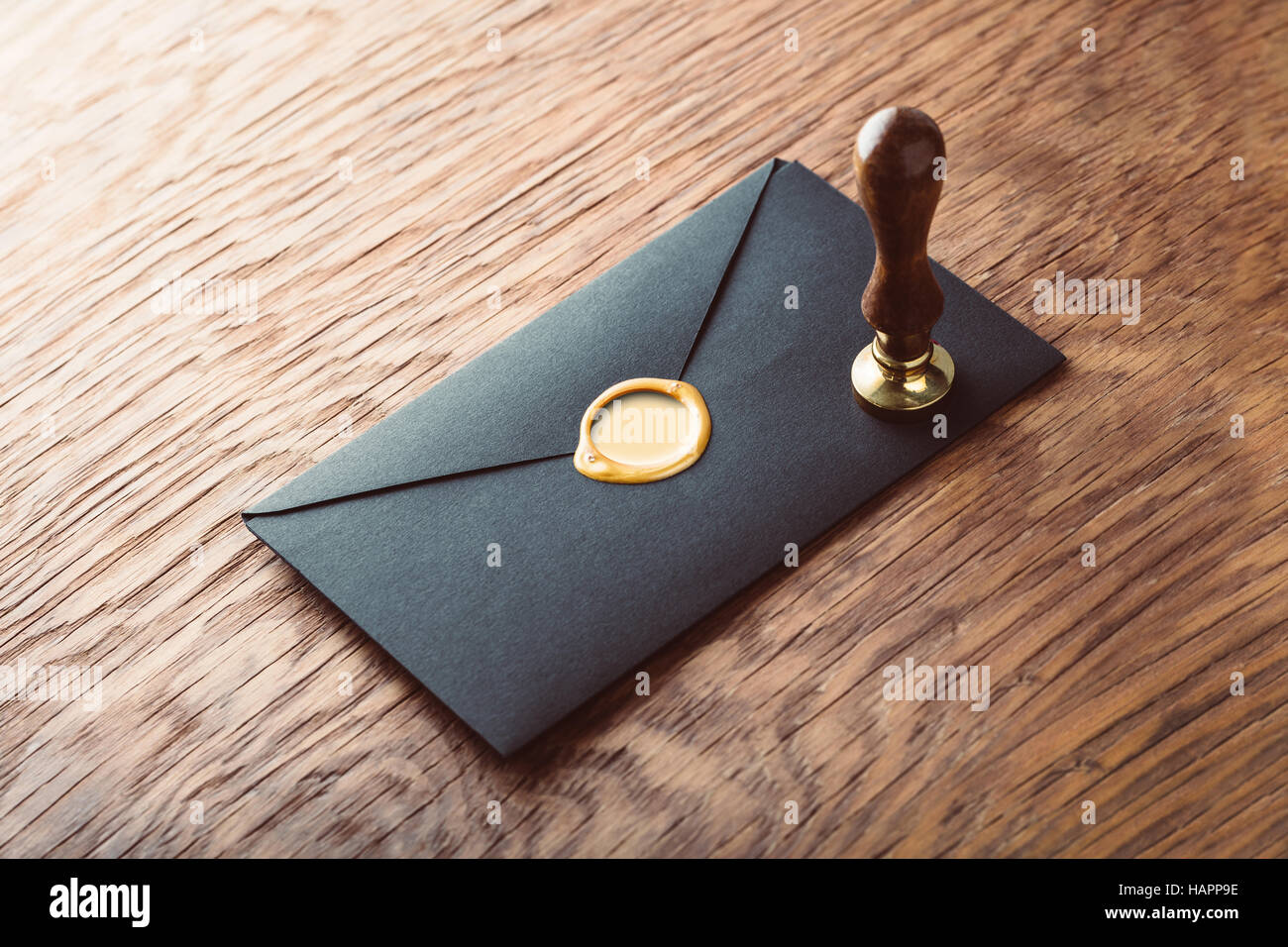 envelope with a stamp on the wooden background Stock Photo - Alamy