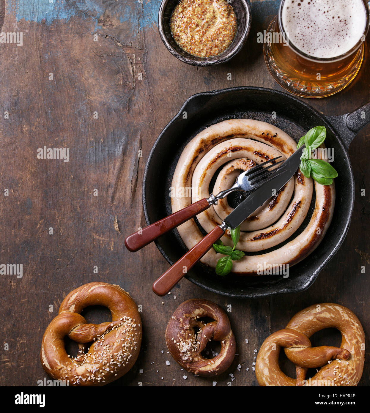 Lager beer with sausage and pretzels Stock Photo - Alamy