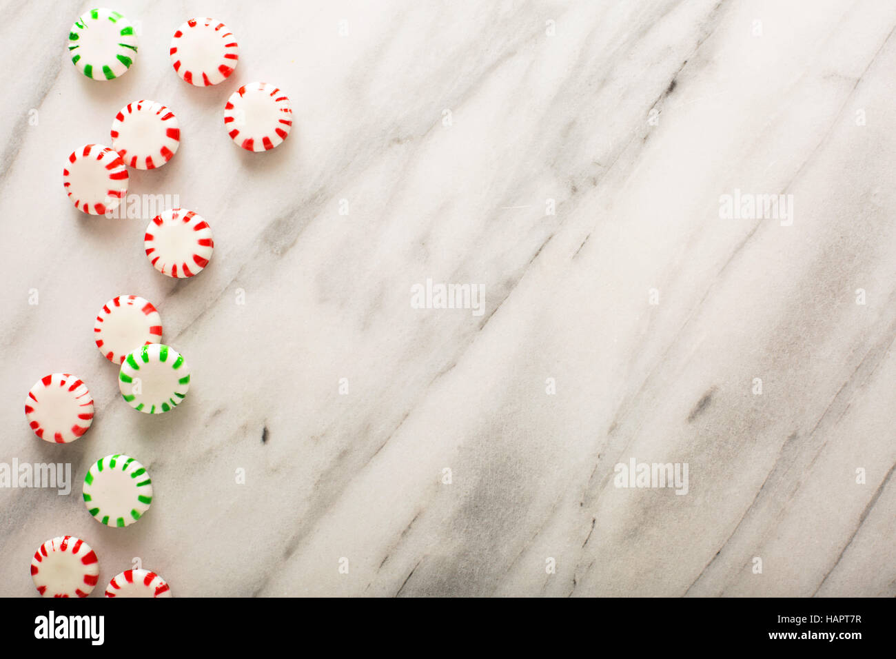 Holiday background with peppermint candy Stock Photo - Alamy