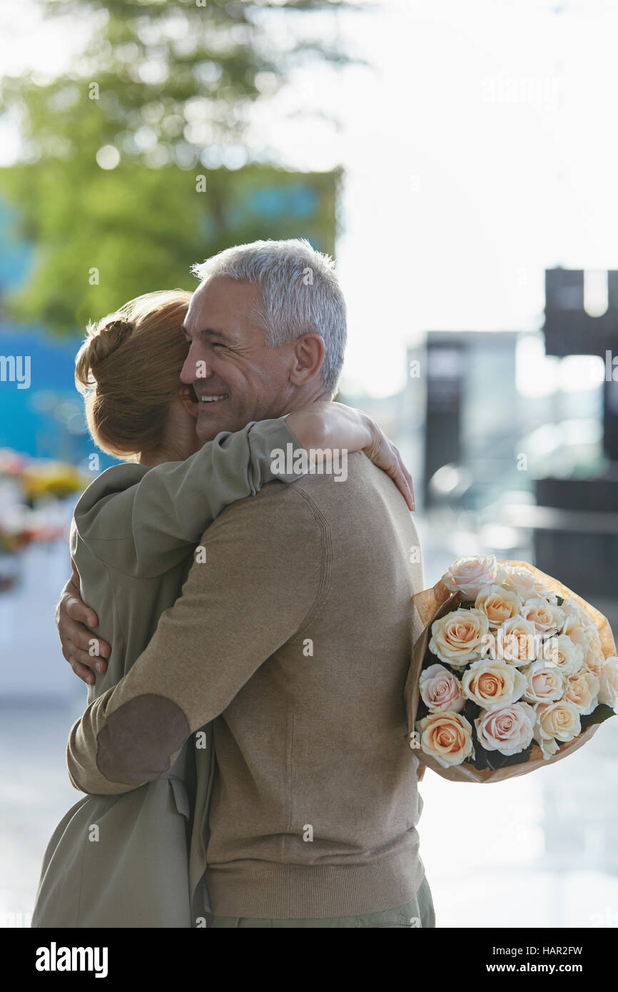 Rose flower gift present hugging hi-res stock photography and images ...