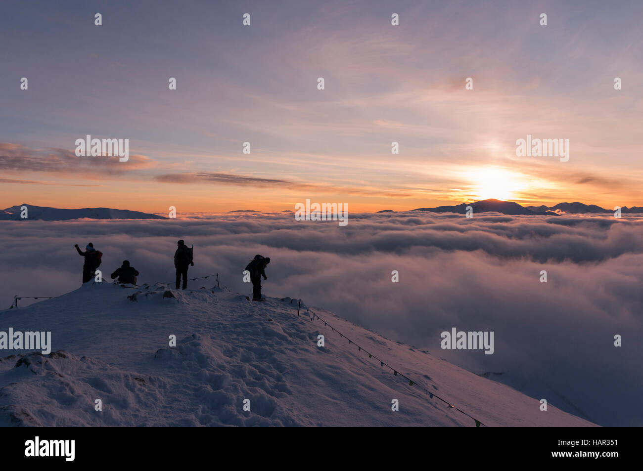 Winter inversion of clouds during the sunset viewed from the summit of ...