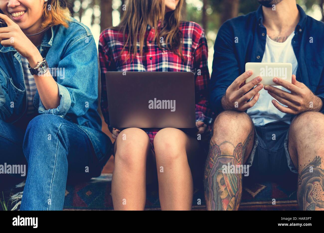 Friends Using Digital Device Outdoors Concept Stock Photo - Alamy