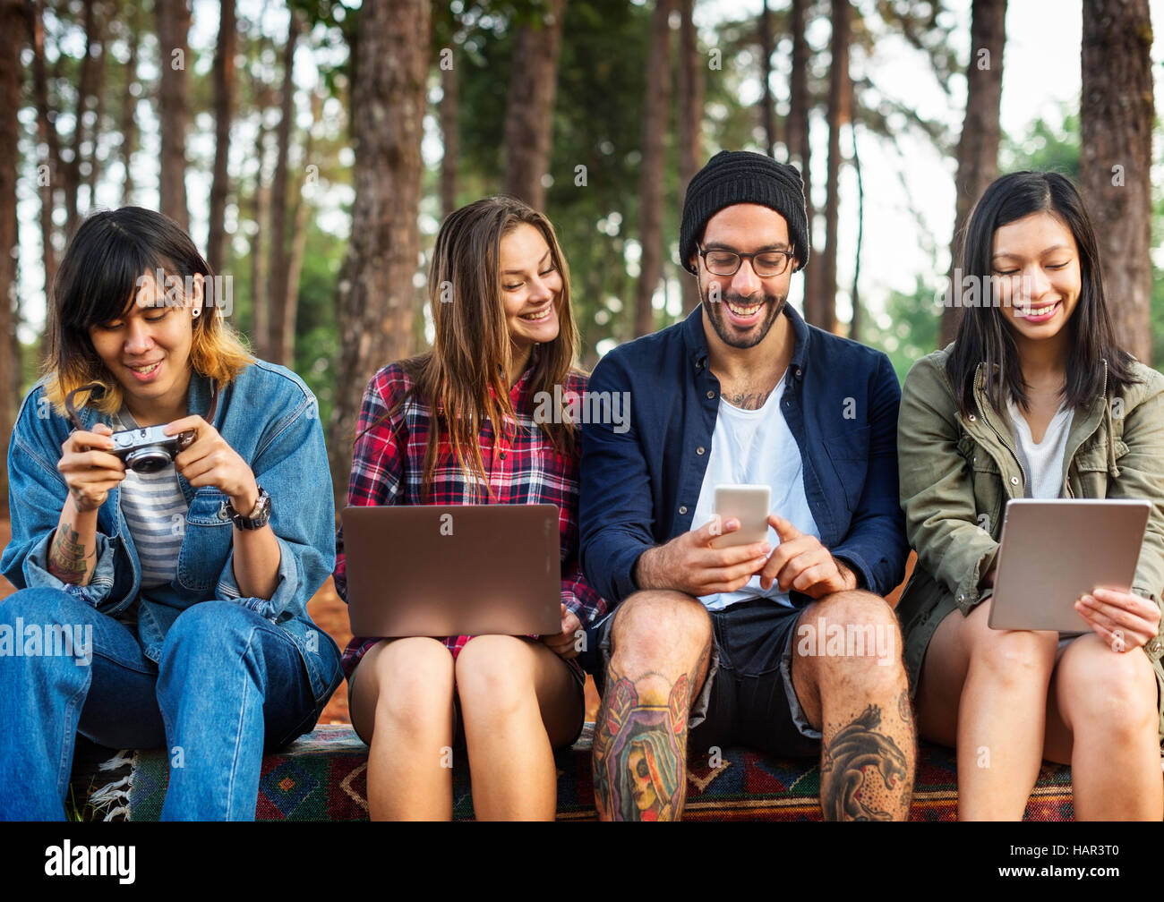 Friends Using Digital Device Outdoors Concept Stock Photo - Alamy