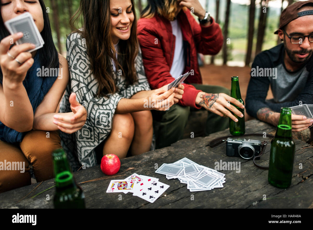 Friends Camping Playing Cards Concept Stock Photo - Alamy