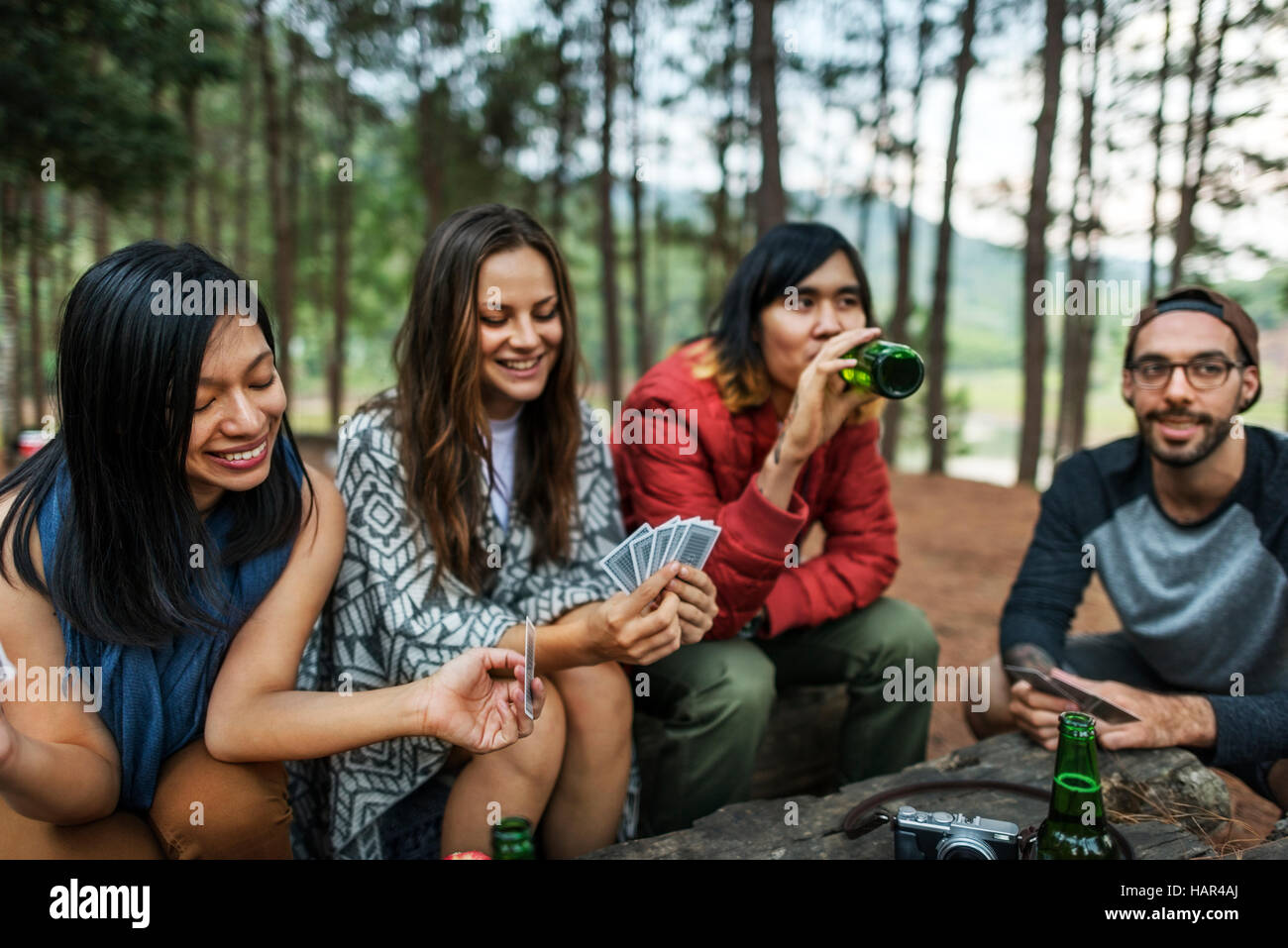 Friends Camping Playing Cards Concept Stock Photo - Alamy