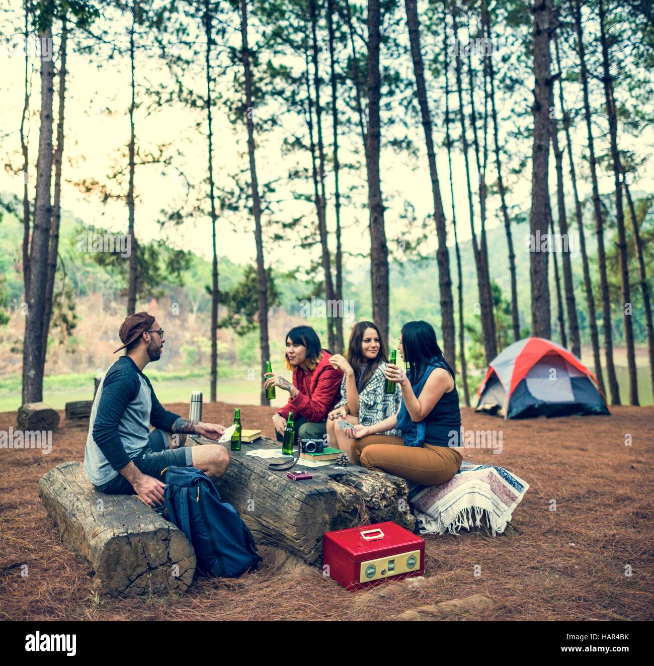 Friends Camping Having Drinks Concept Stock Photo - Alamy