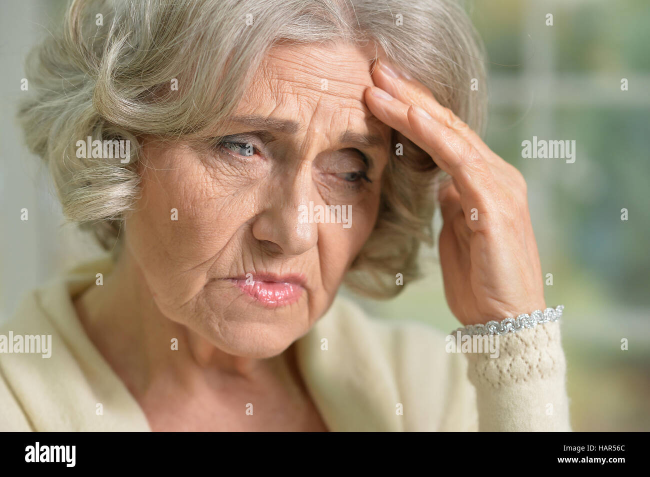 Upset senior woman Stock Photo - Alamy
