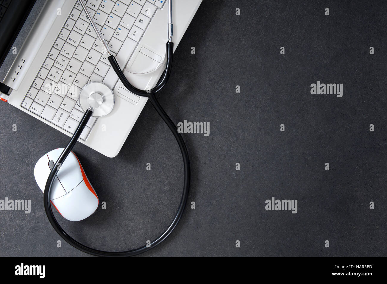 Laptop and a stethoscope on the desk. Concept of computer diagnosis ...