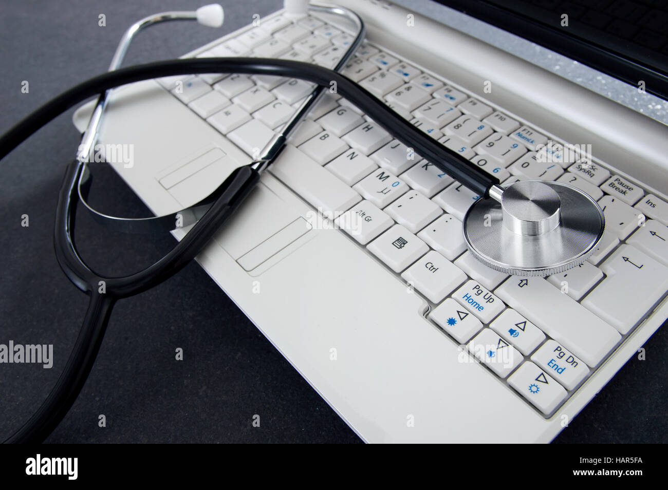 Laptop and a stethoscope on the desk. Concept of computer diagnosis ...