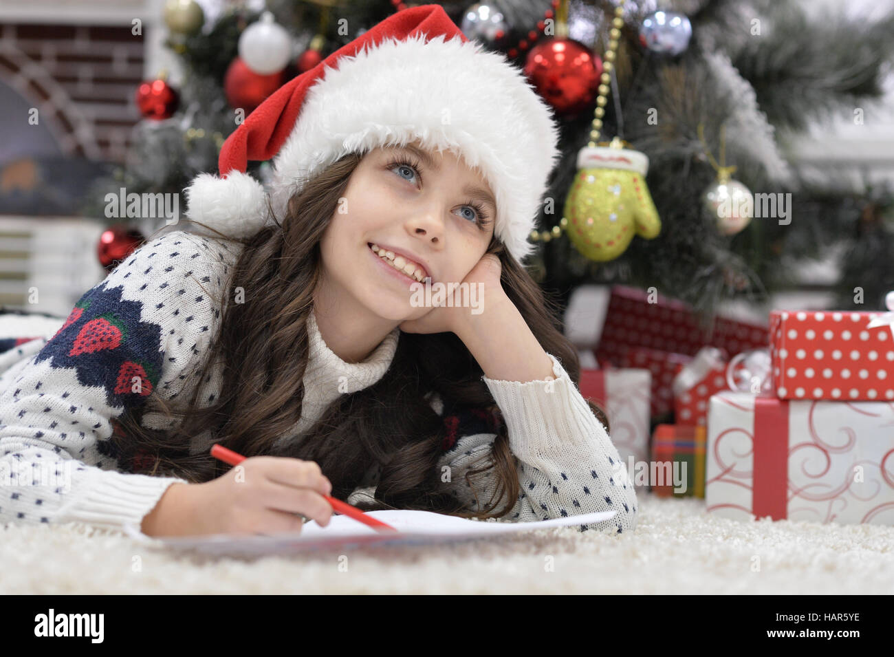 Girl writing letter Stock Photo - Alamy