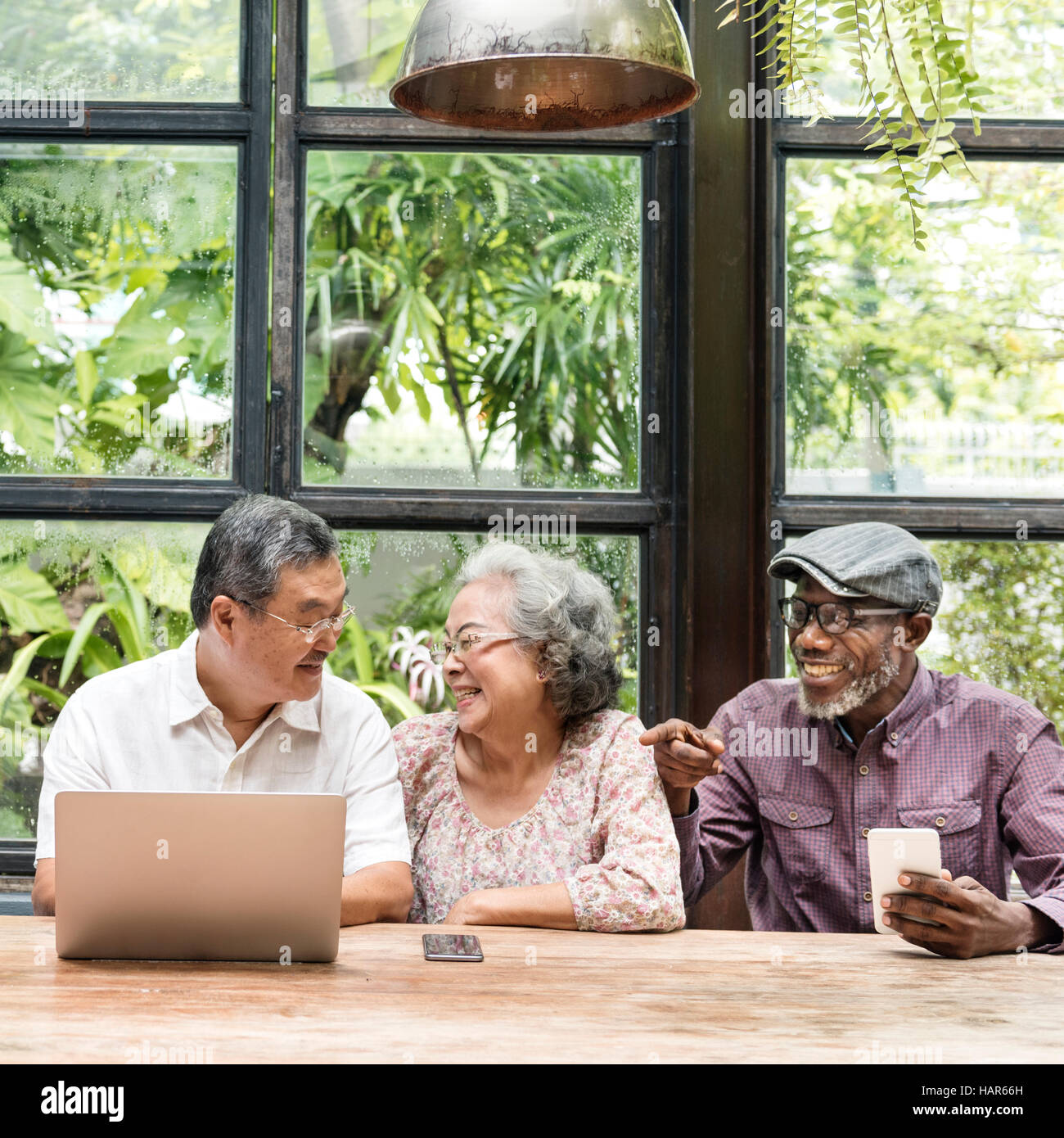 Diverse older people using technology hi-res stock photography and ...