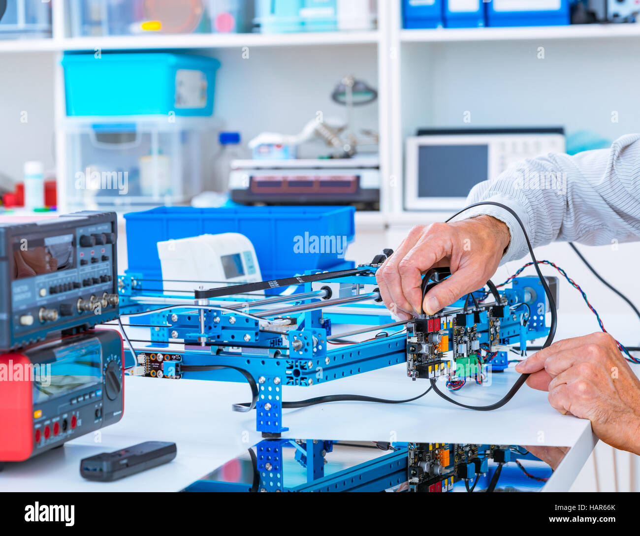 Adjusting an industrial robot with a CNC computer control Stock Photo ...
