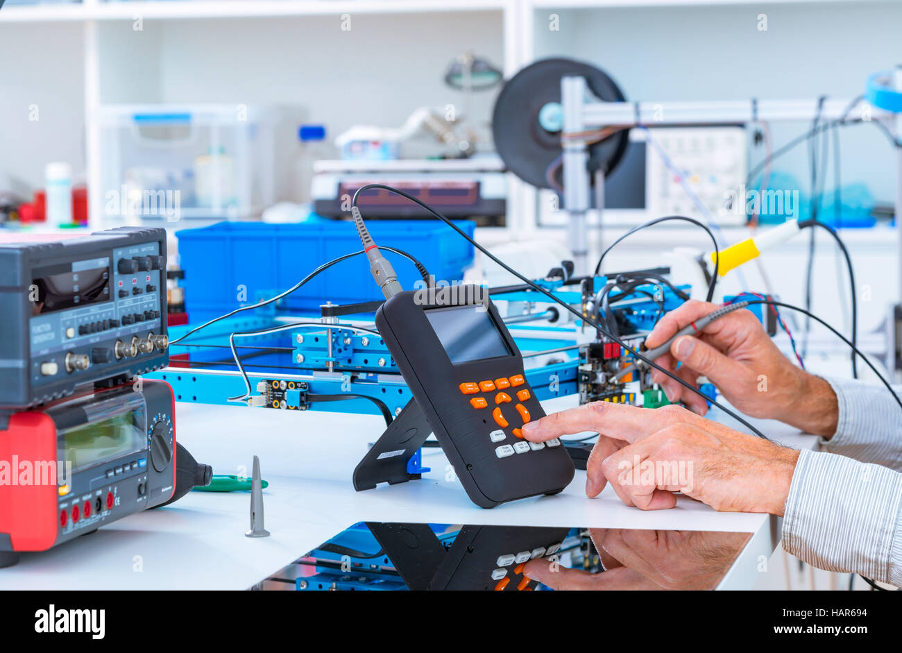 Adjusting an industrial robot with a CNC computer control Stock Photo ...