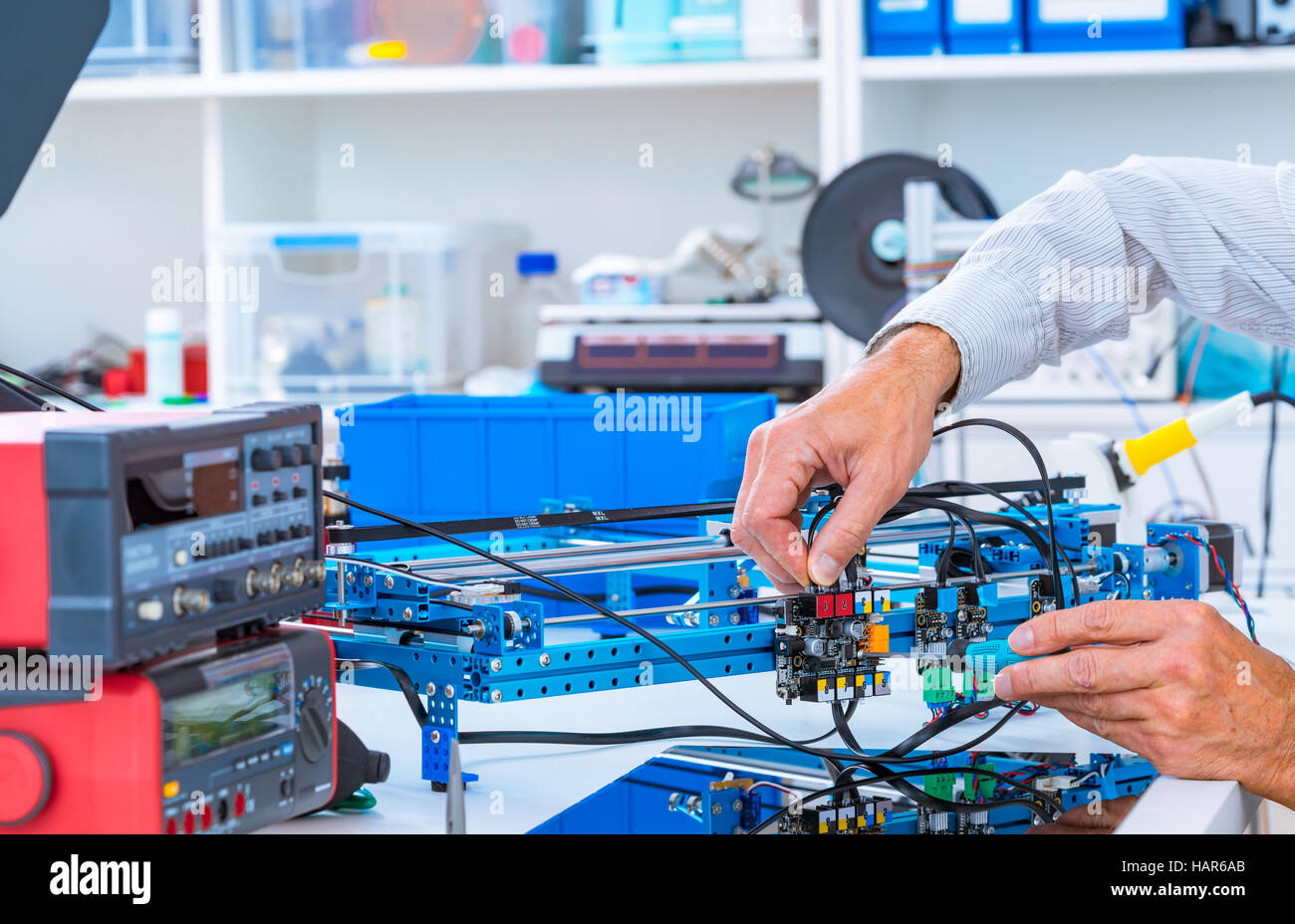 Adjusting an industrial robot with a CNC computer control Stock Photo ...