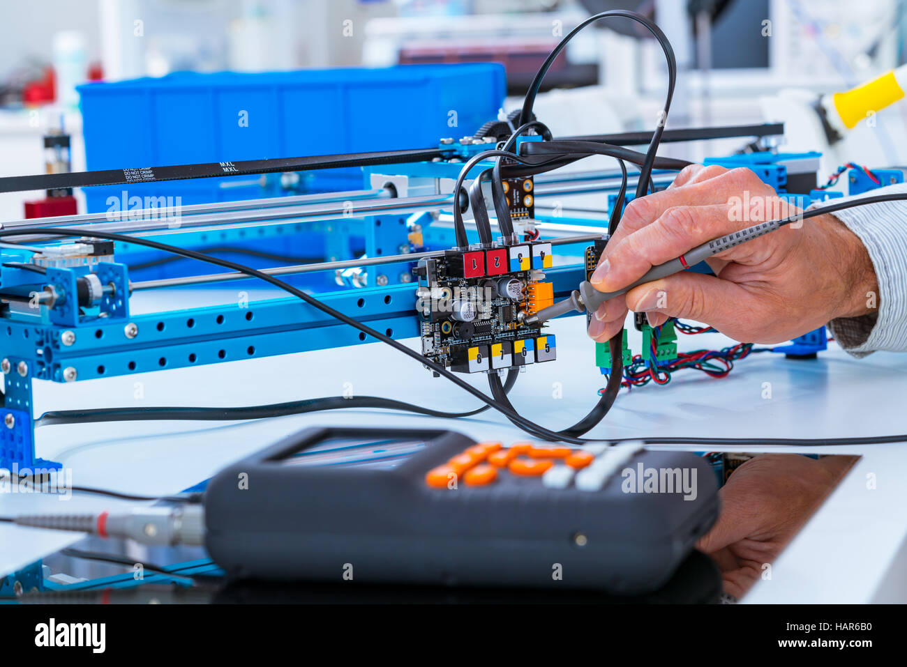 Adjusting an industrial robot with a CNC computer control Stock Photo ...