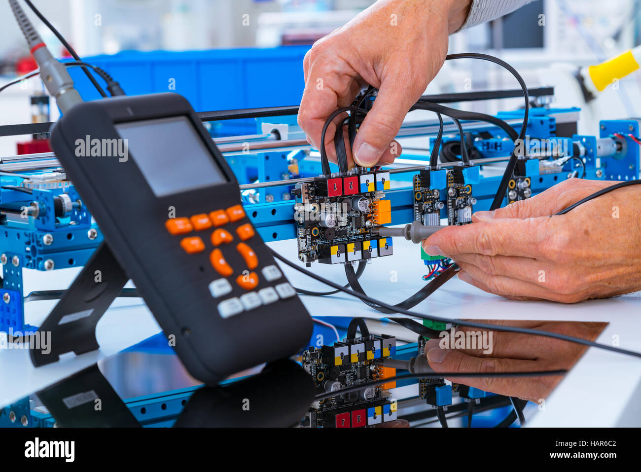 Adjusting an industrial robot with a CNC computer control Stock Photo ...