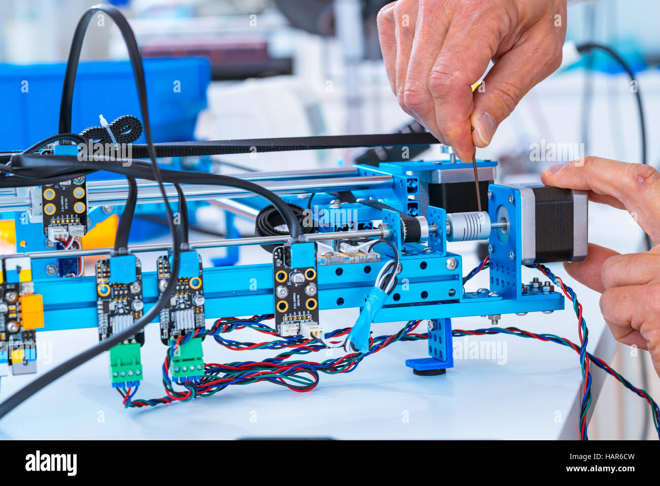 Adjusting an industrial robot with a CNC computer control Stock Photo ...