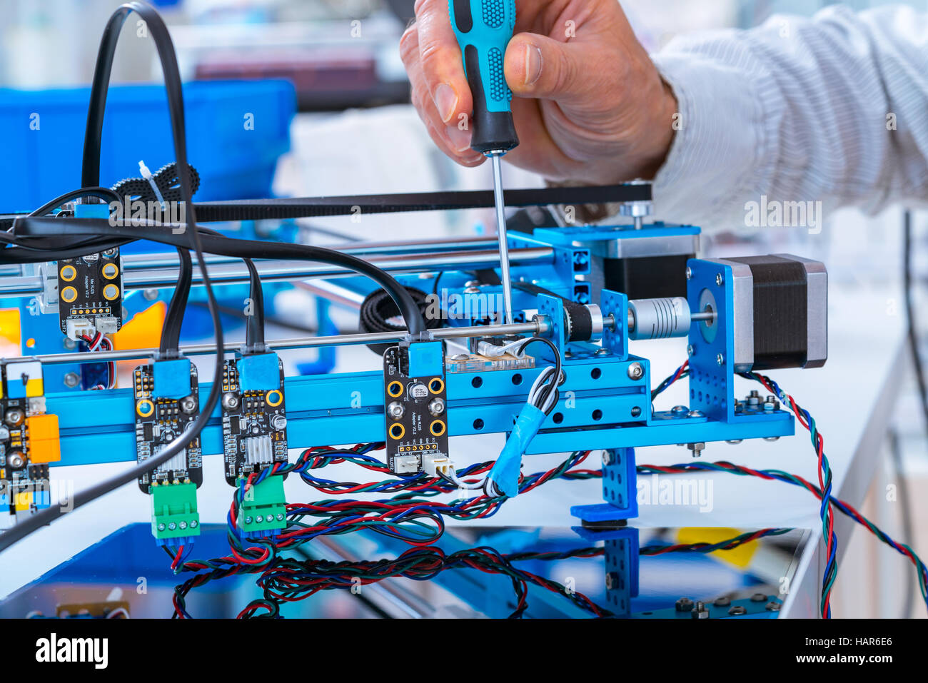 Adjusting an industrial robot with a CNC computer control Stock Photo ...