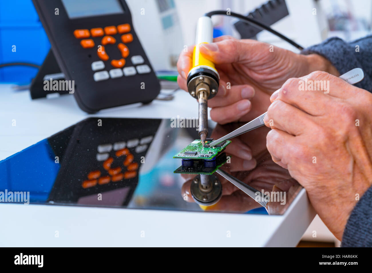 Adjusting an industrial robot with a CNC computer control Stock Photo ...