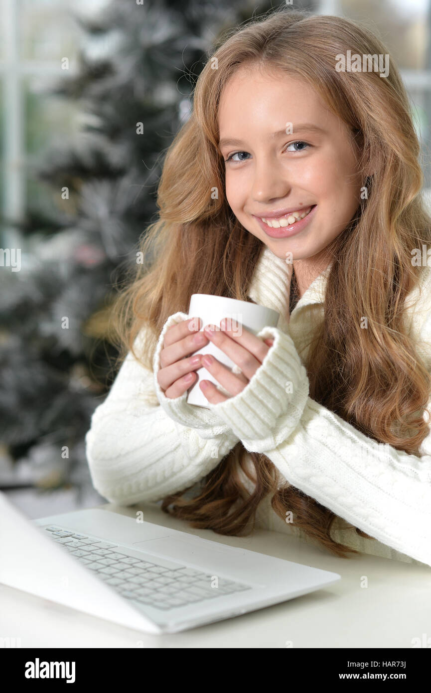 Girl drinking tea Stock Photo - Alamy